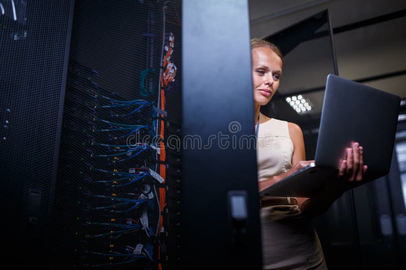 It Engineer Standing Amid Working Server Racks Doing Routine ...