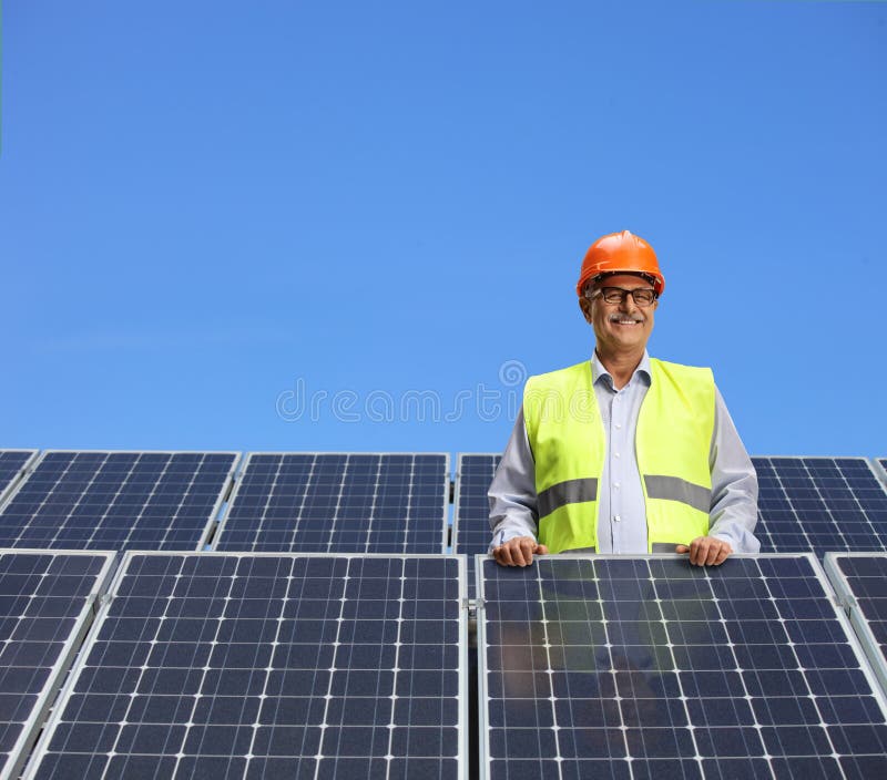 Engineer Standing Behind Solar Panels Stock Photo - Image of male ...