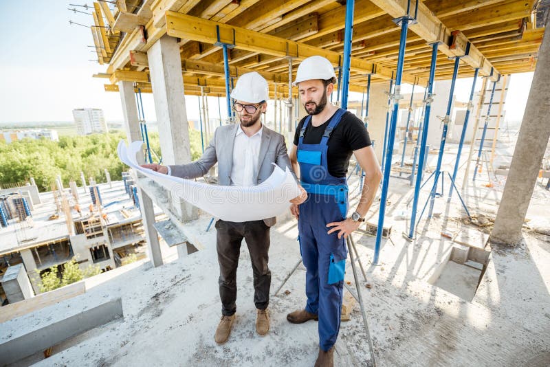 Engineer with Builder on the Structure Stock Photo - Image of ...