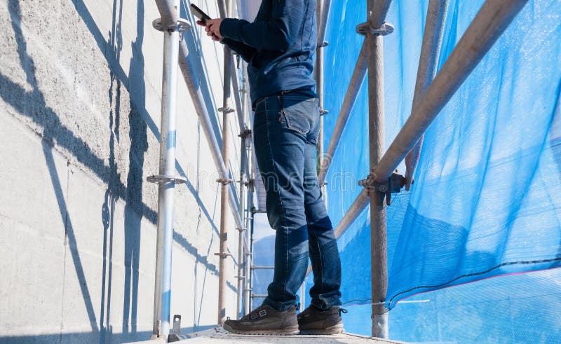 Engineer Standing Inside Scaffolding with Scaffold Netting. Stock Image ...