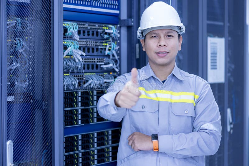It Engineer Standing and Posing with Crossed Arms in a Working Data ... It Engineer Standing and Posing with Crossed Arms in a Working Data ...