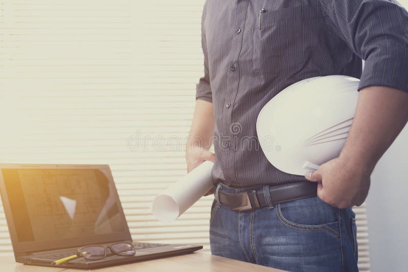 An Engineer Standing beside a Work Desk Stock Image - Image of material ...