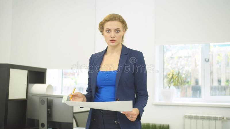 Engineer Stands with Big Scheme in Hands and Looks at the Camera Stock ...