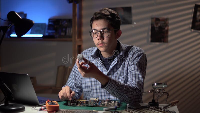 Engineer Student Inspecting Disassembled Broken Motherboard Use Laptop ...