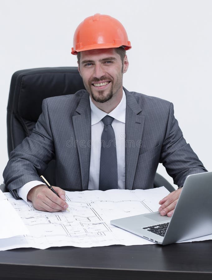 Engineer is Studying the Draft,sitting Behind a Desk Stock Photo ...
