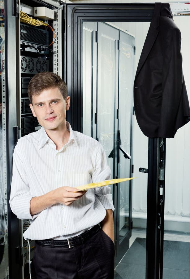 The Engineer In A Data Processing Center Stock Photo - Image of orange ...
