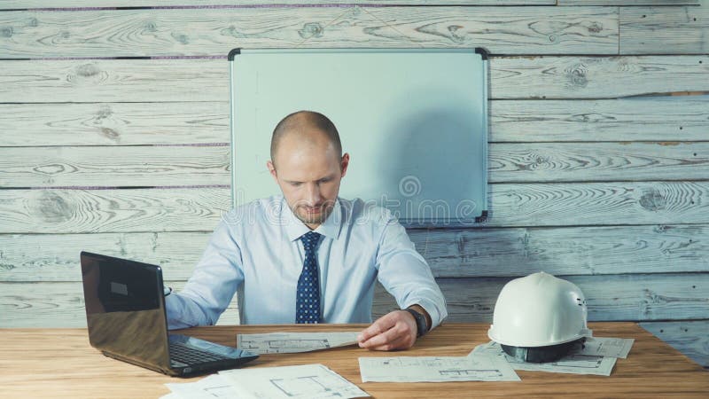 Engineer Supervisor Working on Drawings in the Office. Stock Image ...