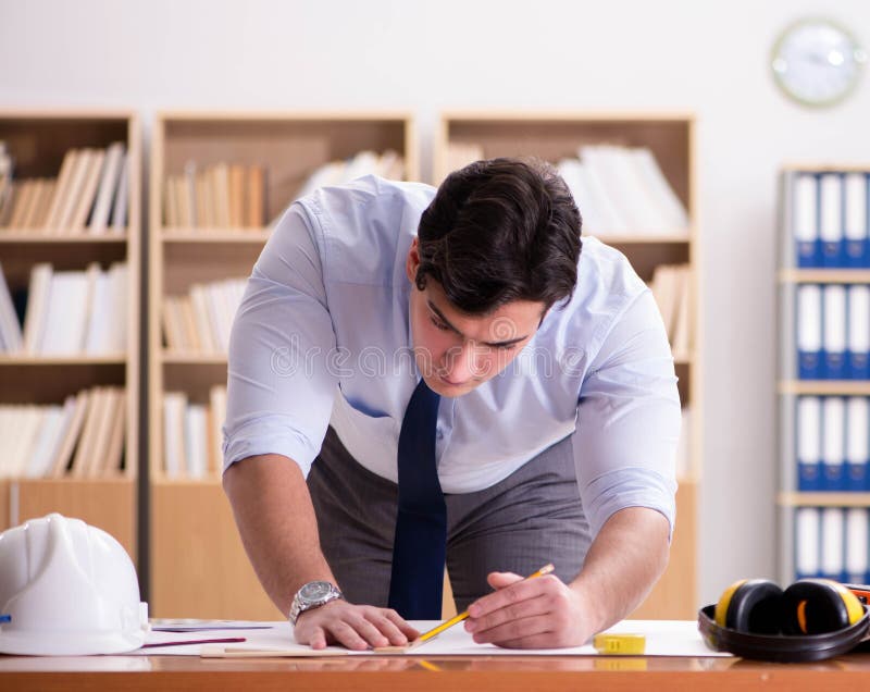 Engineer Supervisor Working on Drawings in the Office Stock Image ...