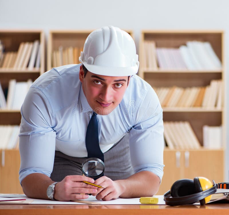 Engineer Supervisor Working on Drawings in the Office Stock Photo ...