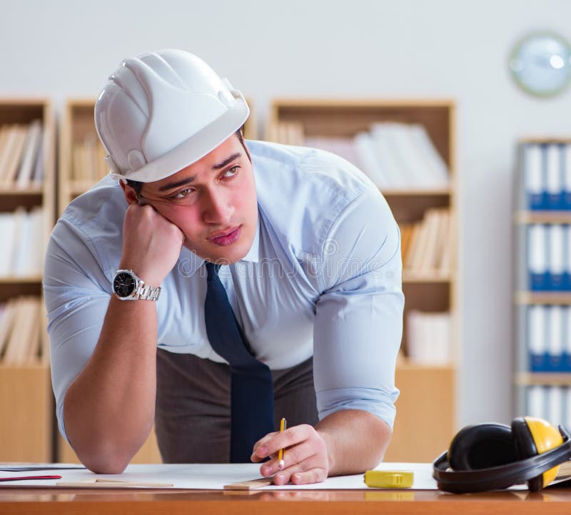 Engineer Supervisor Working on Drawings in the Office Stock Photo ...