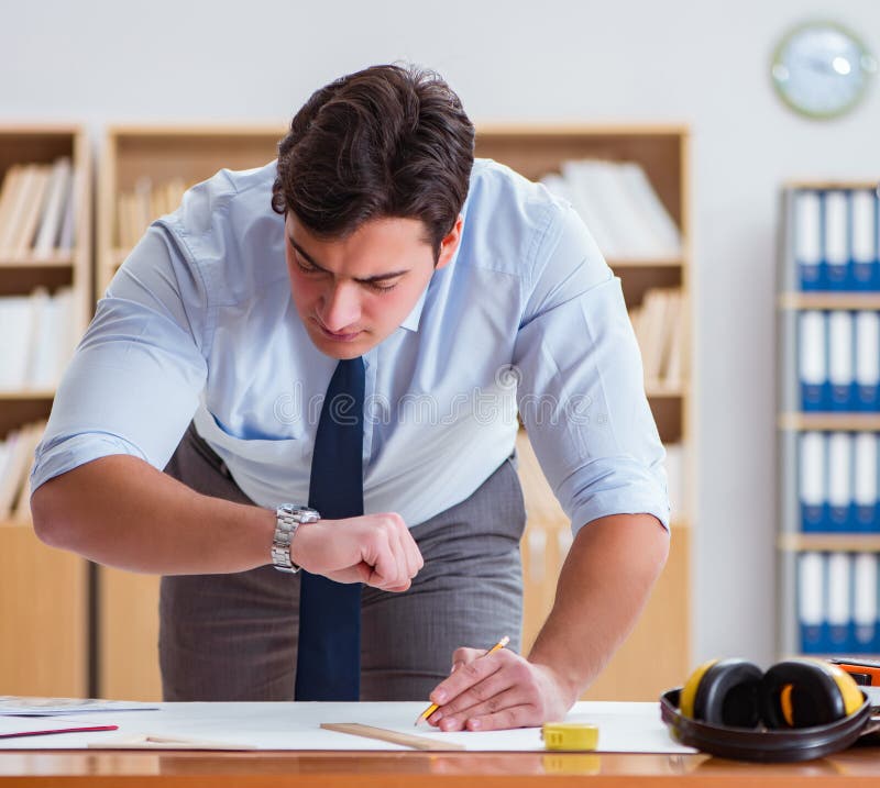 Engineer Supervisor Working on Drawings in the Office Stock Image ...