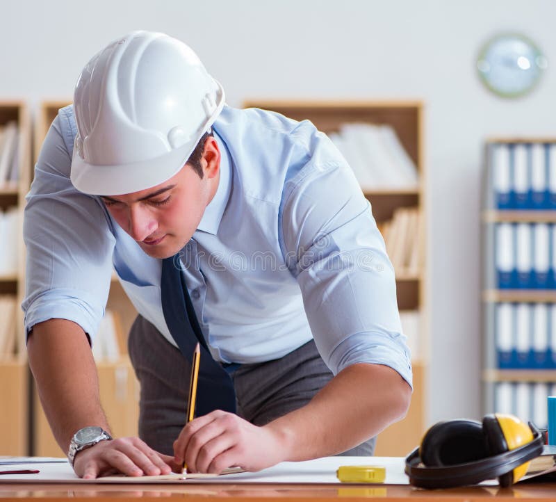 Engineer Supervisor Working on Drawings in the Office Stock Image ...