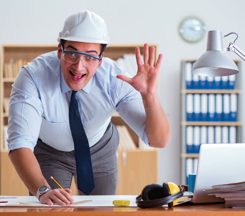 Engineer Supervisor Working on Drawings in the Office Stock Photo ...