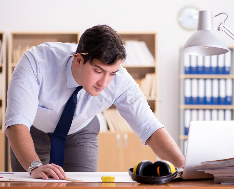 Engineer Supervisor Working on Drawings in the Office Stock Photo ...