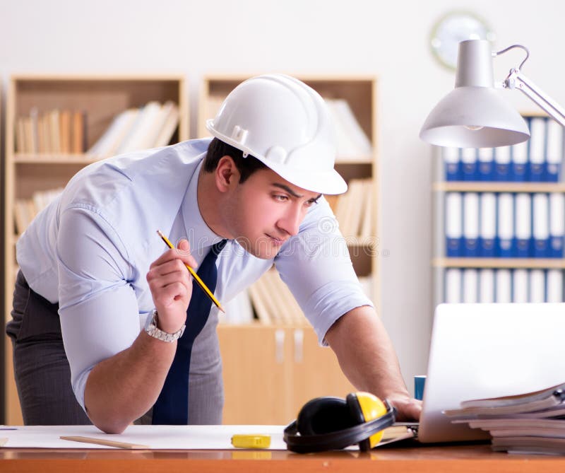 Engineer Supervisor Working on Drawings in the Office Stock Photo ...
