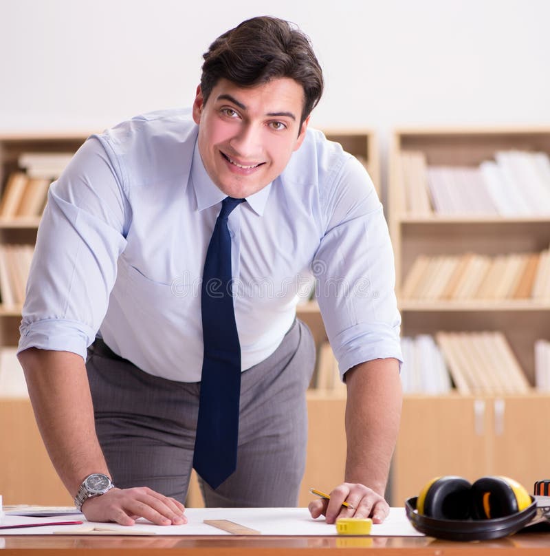 Engineer Supervisor Working on Drawings in the Office Stock Photo ...