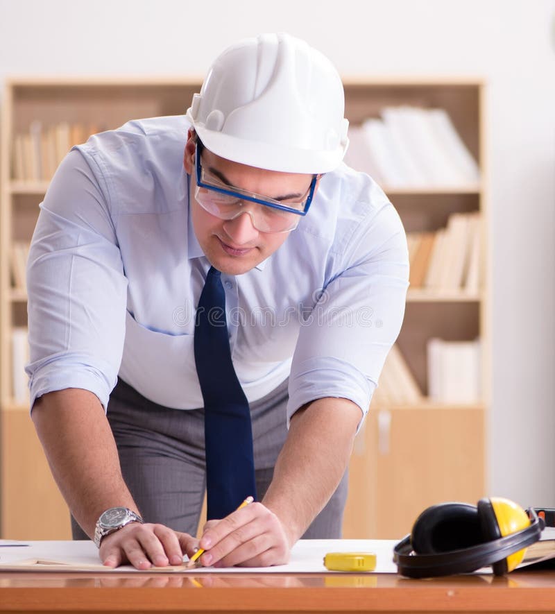 Engineer Supervisor Working on Drawings in the Office Stock Photo ...