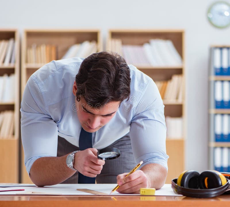 Engineer Supervisor Working on Drawings in the Office Stock Photo ...