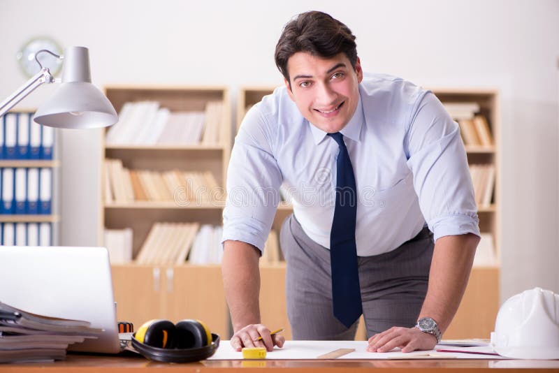 The Engineer Supervisor Working on Drawings in the Office Stock Image ...