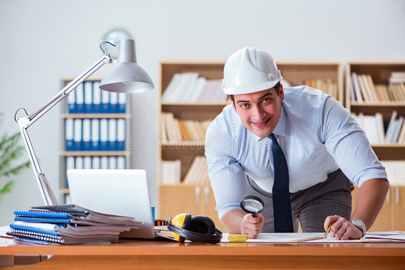 The Engineer Supervisor Working on Drawings in the Office Stock Photo ...