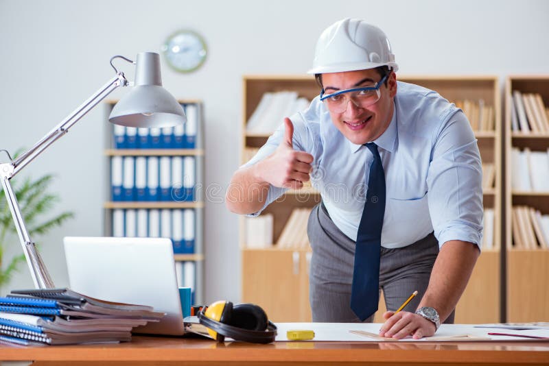 The Engineer Supervisor Working on Drawings in the Office Stock Photo ...