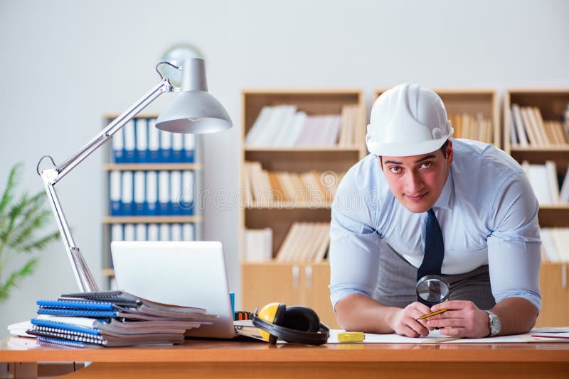 The Engineer Supervisor Working on Drawings in the Office Stock Image ...