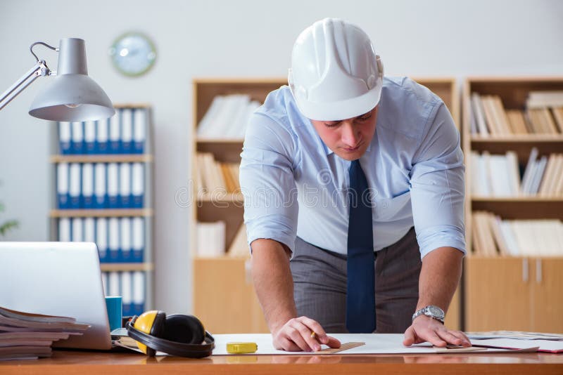 The Engineer Supervisor Working on Drawings in the Office Stock Image ...