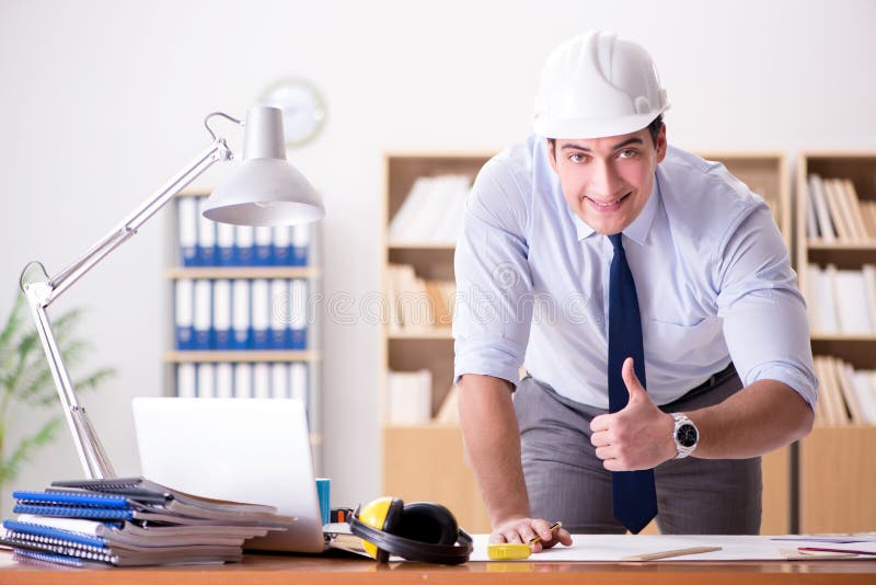 The Engineer Supervisor Working on Drawings in the Office Stock Image ...
