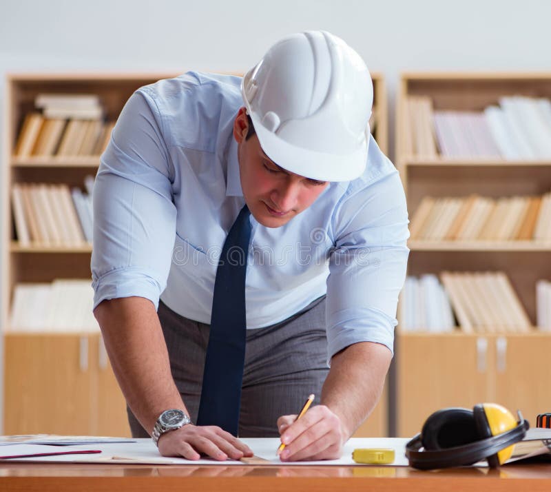 Engineer Supervisor Working on Drawings in the Office Stock Image ...