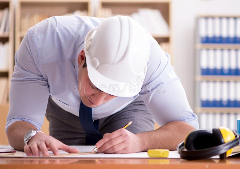 Engineer Supervisor Working on Drawings in the Office Stock Image ...