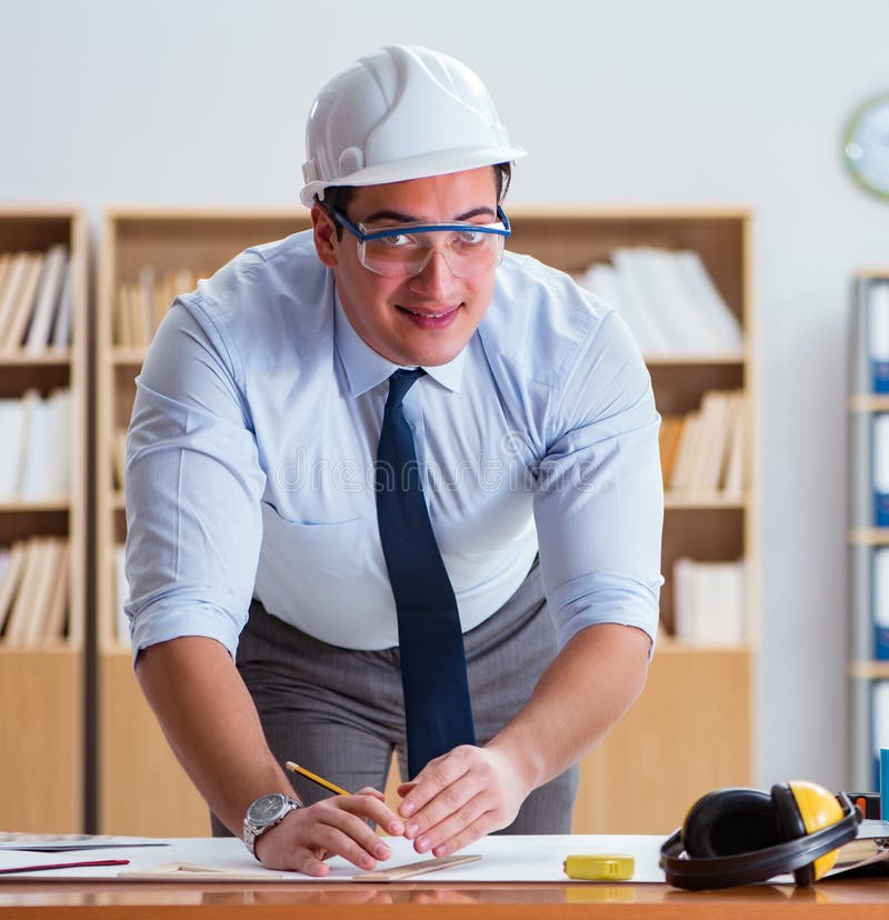 Engineer Supervisor Working on Drawings in the Office Stock Photo ...