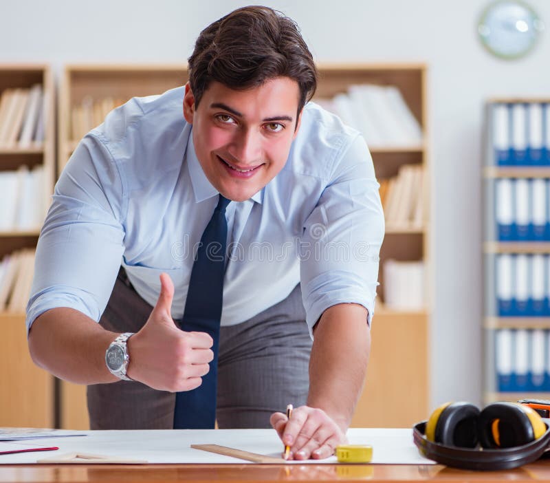 Engineer Supervisor Working on Drawings in the Office Stock Photo ...