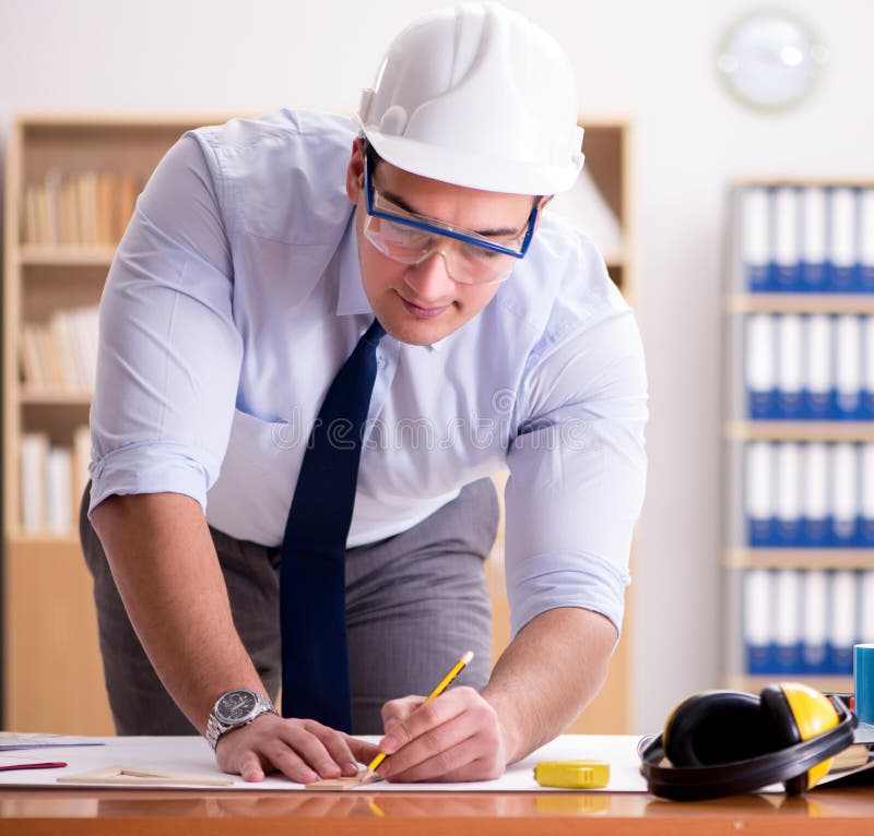 Engineer Supervisor Working on Drawings in the Office Stock Photo ...