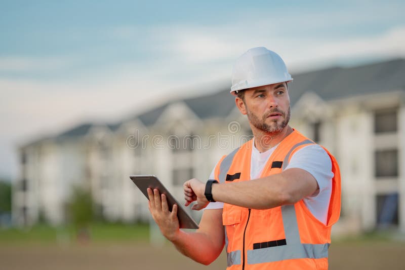 Engineer with Tablet, Building Inspection. Construction Man in Helmet ...