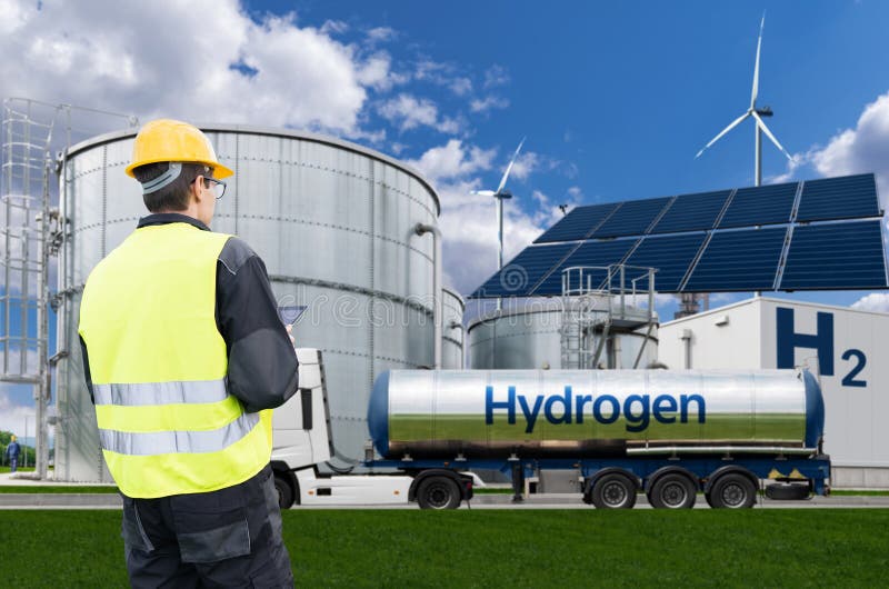 Engineer with Tablet Computer on a Background of Hydrogen Factory ...