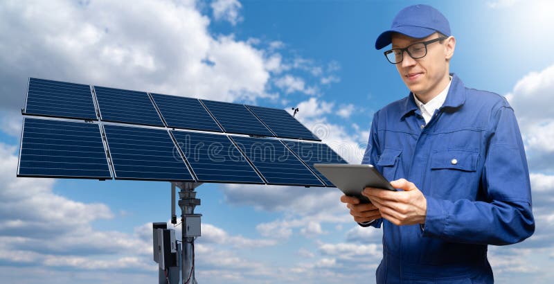 Engineer with Tablet Computer on a Background of Solar Power Station ...