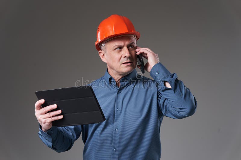 Engineer with Tablet and Mobile Phone Stock Photo - Image of builder ...
