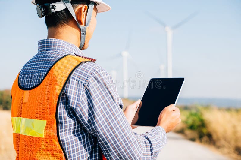 Engineer with Tablet at Windmill Farm Stock Photo - Image of clean ...