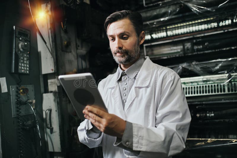 Engineer with Tablet Working at Polymer Factory Stock Photo - Image of ...