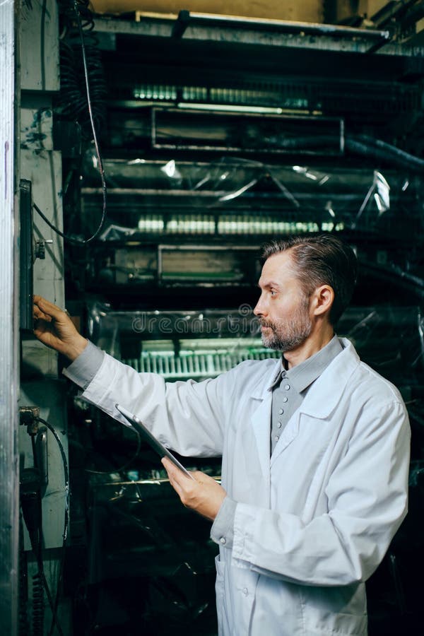 Engineer with Tablet Working at Polymer Factory Stock Photo - Image of ...