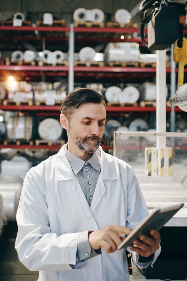 Engineer with Tablet Working at Polymer Factory Stock Image - Image of ...