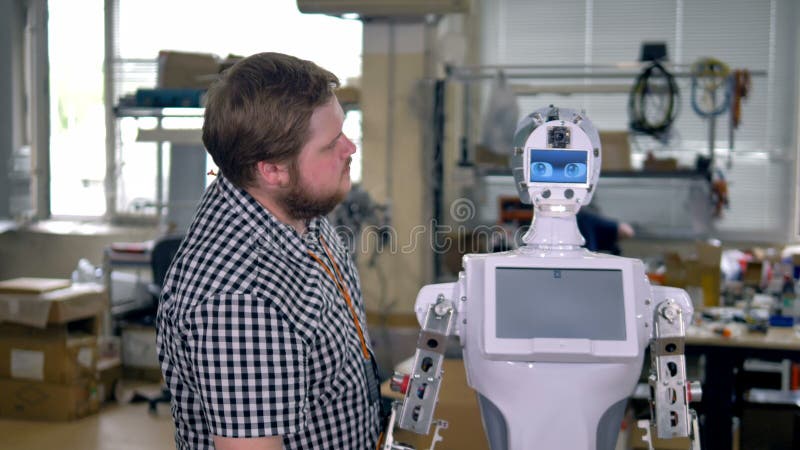 An Engineer Takes Off a Robots Face Panel. Stock Footage - Video of ...