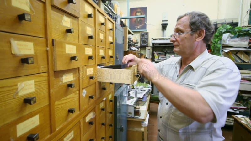 Engineer Takes Some Objects from Cabinet in Stock Footage - Video of ...