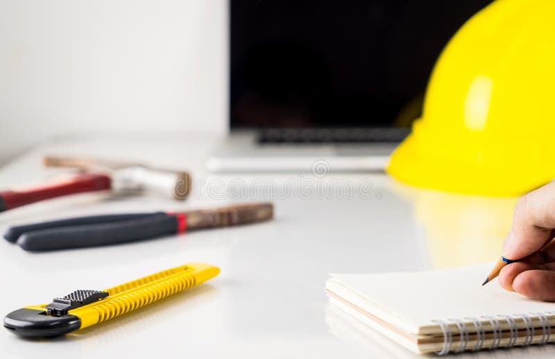 Engineer is Taking Note on a Desk Full of Construction Stock Image ...