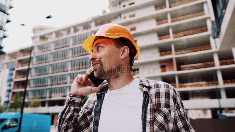 Engineer Talking on Phone. Architect Using Phone on Construction Site ...