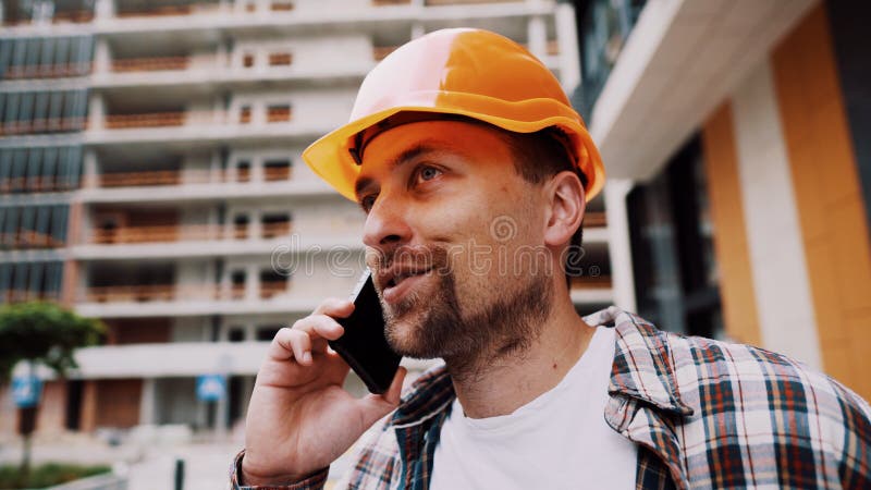 Engineer Talking on Phone. Architect Using Phone on Construction Site ...