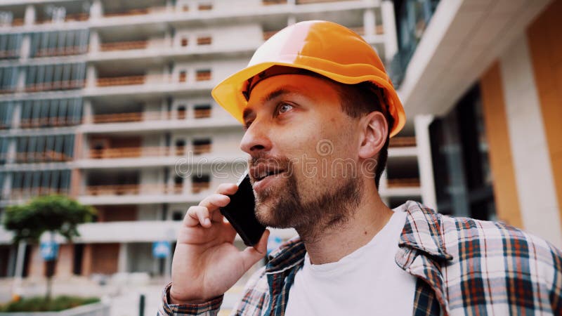 Engineer Talking on Phone. Architect Using Phone on Construction Site ...