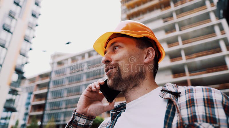 Engineer Talking on Phone. Architect Using Phone on Construction Site ...