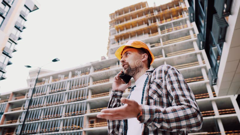 Engineer Talking on Phone. Architect Using Phone on Construction Site ...