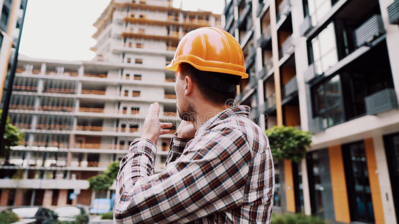 Engineer Talking on Phone. Architect Using Phone on Construction Site ...